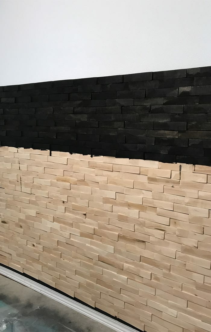 How to Create a Dramatic Wood Shims Wall in Your Home